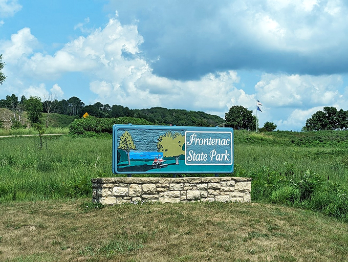 Frontenac's sign promises adventure, while the backdrop delivers pure Midwest eye candy.
