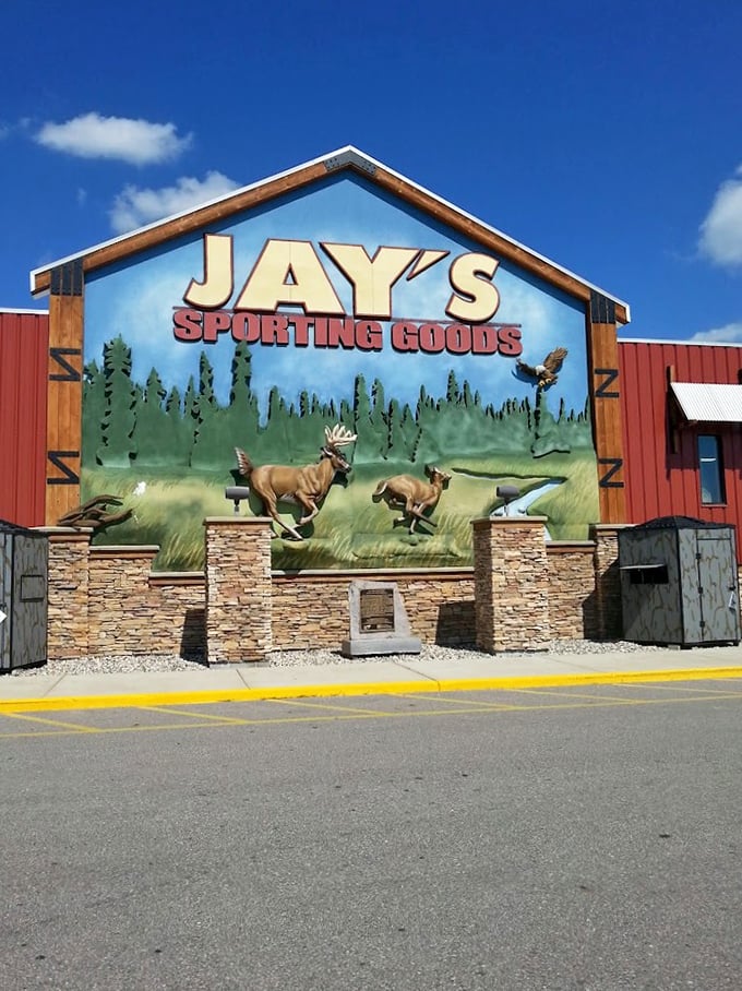 Outdoor enthusiast's Disneyland! Jay's larger-than-life mural sets the stage for an adventure in retail wilderness.