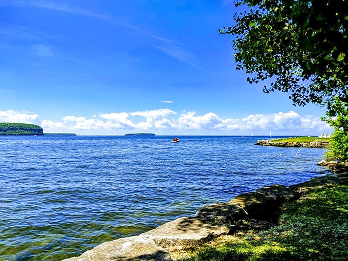 Where limestone meets leisure - Door County's crown jewel sparkles with sailboats dancing across Green Bay's azure waters.