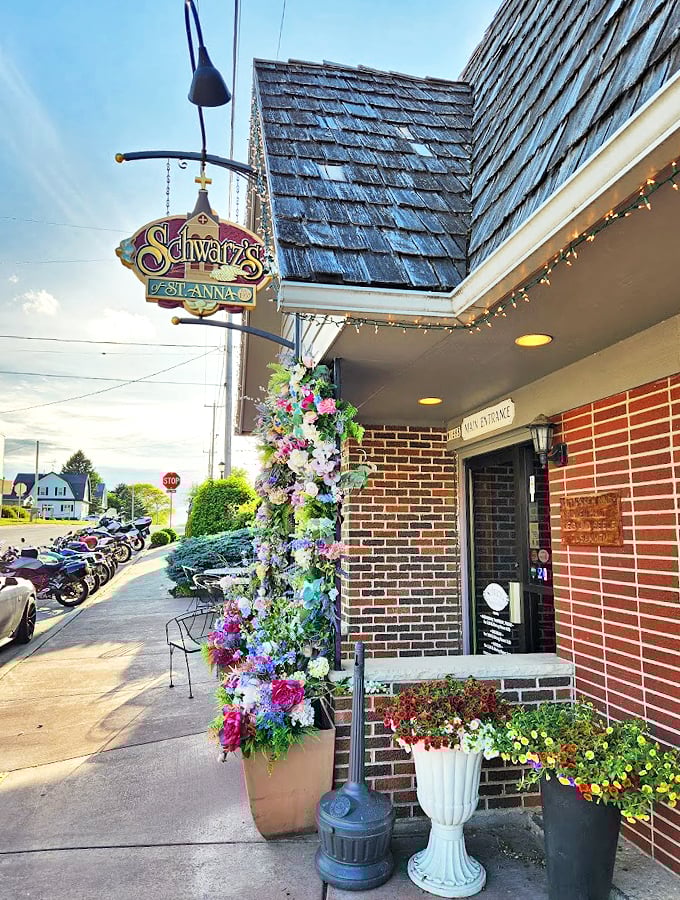 Flower baskets cascade with color at this charming brick-faced favorite, where hospitality blooms year-round.