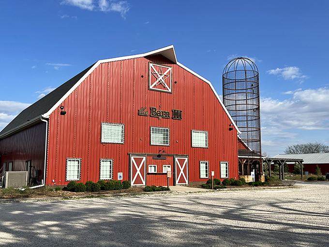 Red alert for fun! This isn't your average barn - it's a cornfield Colosseum of comedy, drama, and delicious eats.