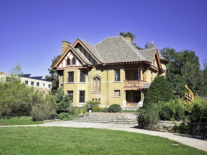 The historic Dean's Residence, a beautiful Victorian Gothic-style house built in 1896 that serves as a centerpiece for the gardens.