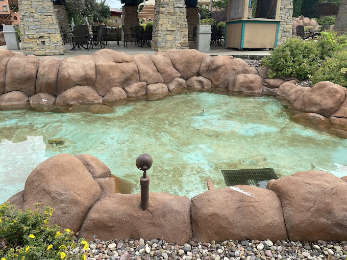 Who needs a natural hot spring when you've got this perfectly sculpted rock water display? It's like the Flintstones designed a luxury spa! Photo credit: Stu Surface