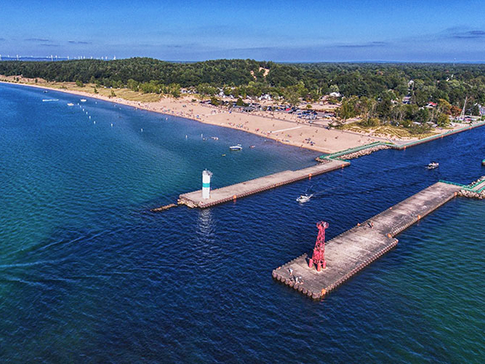 Twilight tranquility in Pentwater! As night falls, the town's lights reflect off the calm waters, creating a real-life Impressionist painting.