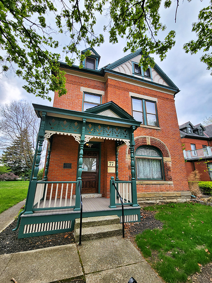 Red brick, green trim, and a whole lot of wit. It's like a book of comedic essays came to life as architecture.