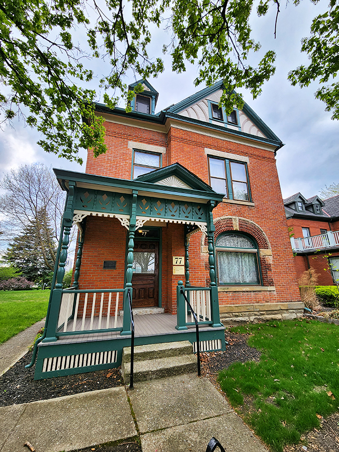 Red brick, green trim, and a whole lot of wit. It's like a book of comedic essays came to life as architecture.