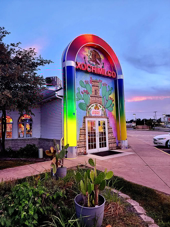 Who needs a passport? Xochimilco's vibrant arch is your ticket to flavor town, no TSA pat-down required! Photo credit: Claudine Fuller