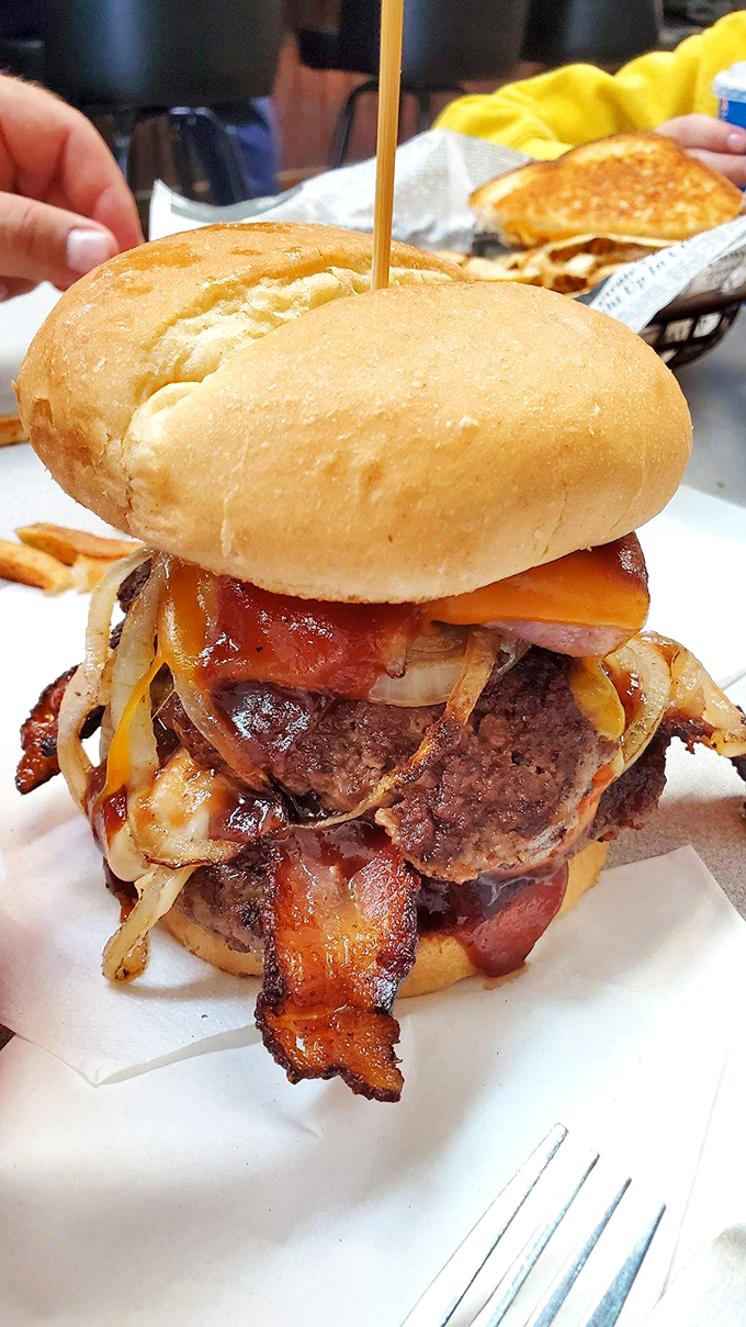 Now that's what I call a burger! It's not just a meal; it's a delicious Jenga tower of flavor.
