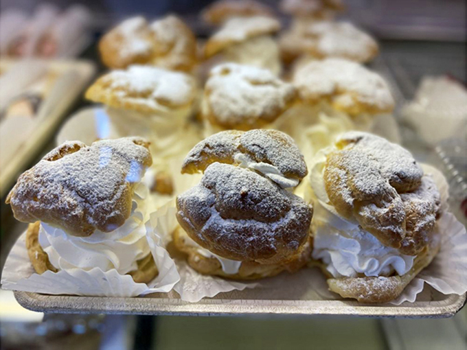 Cream puffs that could double as pillows for elves. Light, airy, and dusted with powdered sugar snow &ndash; dessert or edible art?