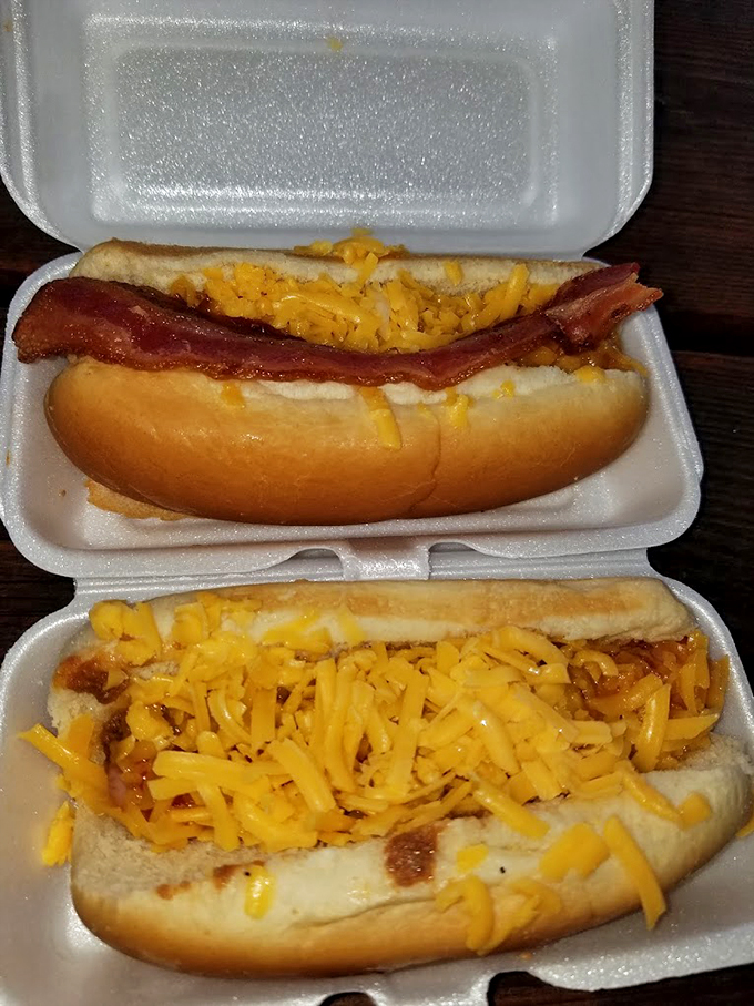 "Bacon me crazy!" These hot dogs are living their best life, crowned with crispy bacon and a shower of cheese.