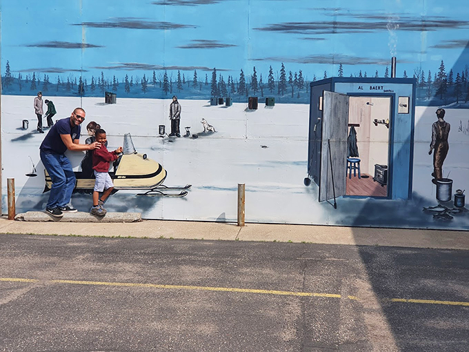 Ice fishing: where 'gone fishin'' meets 'freezin' for a reason'! This mural captures the chilly charm of a Minnesota winter pastime.