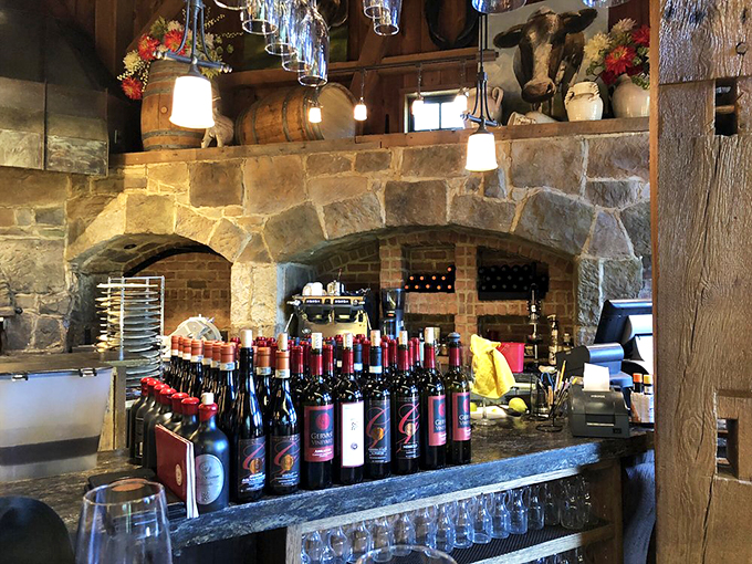 Bottles, barrels, and stone arches - oh my! This rustic bar scene is what happens when a winery and a castle have a beautiful baby.