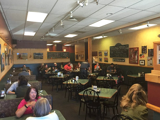Ah, the sweet symphony of clinking cutlery and coffee-fueled chatter. This bustling dining room is where strangers become friends, united by the universal language of good grub.
