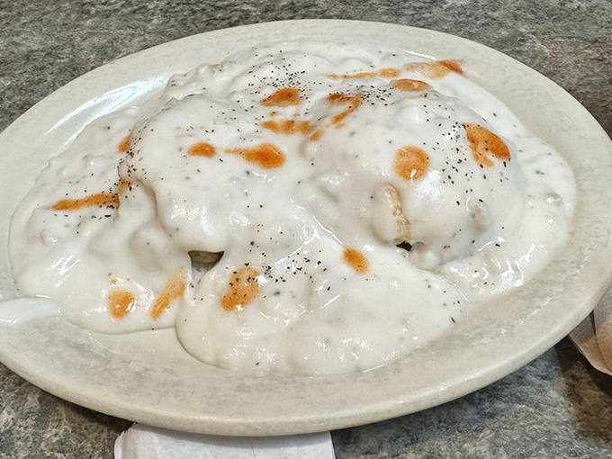 Biscuits and gravy: the comfort food that hugs you from the inside out. This creamy, peppery blanket of goodness could make a grown man weep. Photo credit: Jon H.