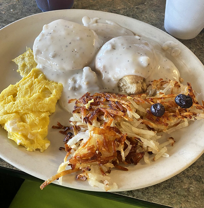Biscuits and gravy: the breakfast equivalent of a warm hug from your favorite aunt. These golden pillows of joy are smothered in gravy so good, you'll want to bathe in it. Photo credit: Karen B.