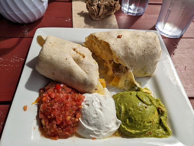 A breakfast burrito that means business, complete with fresh salsa, guacamole, and sour cream. Tex-Mex meets Down East. Photo credit: Sara M