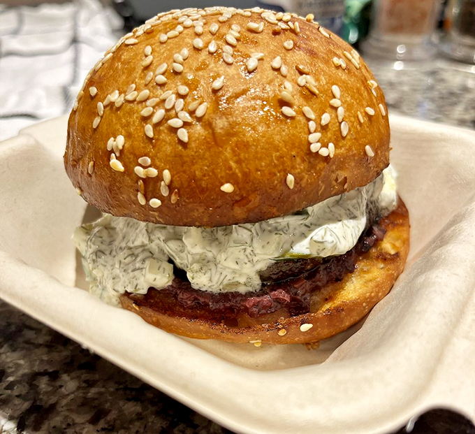 This tzatziki-topped burger isn't just a meal, it's a Mediterranean vacation between two perfectly toasted buns.