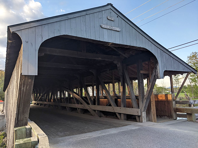 Peek-a-boo, I see you! The bridge plays hide and seek with the charming Waitsfield village, framing a scene straight out of a Norman Rockwell painting.