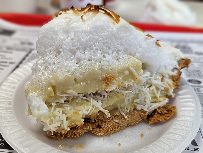 Cloud nine, meet plate. This coconut cream pie looks so heavenly, it might just float away if you don't anchor it down with your fork.