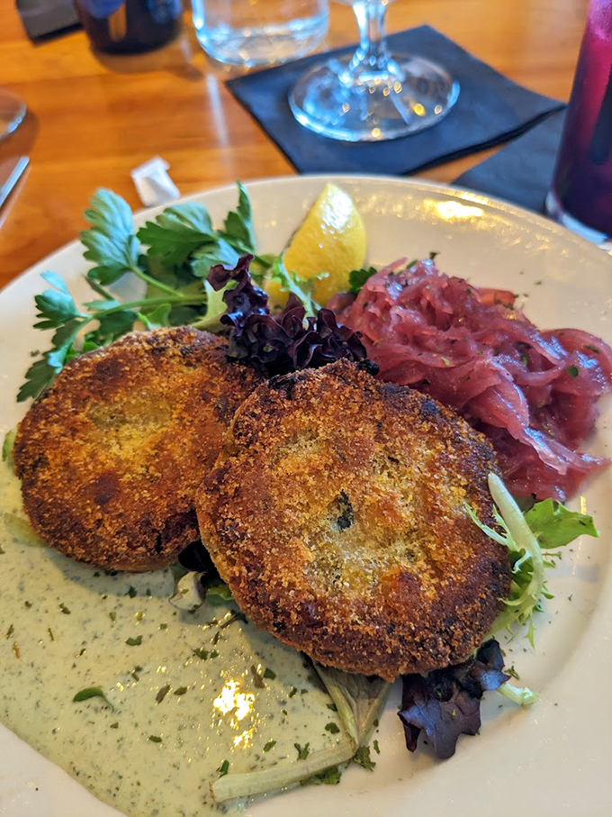 Golden-brown crab cakes that look like they just won first prize at the county fair, served with zesty remoulade. Photo credit: Jennifer Nolen