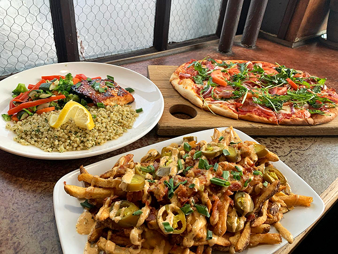 A feast for the eyes: grilled salmon over quinoa, artisanal pizza, and loaded fries that'll make your taste buds sing.