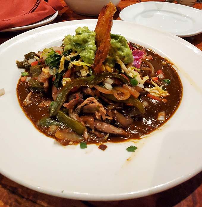 A close-up that'll make your taste buds tango. This duck carnitas dish is so pretty, it's almost too good to eat. Almost.