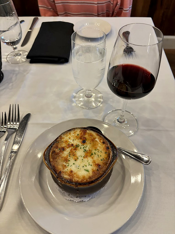 A masterpiece of melted cheese and rich broth, this French onion soup is what comfort food dreams are made of. Photo credit: Laurie D