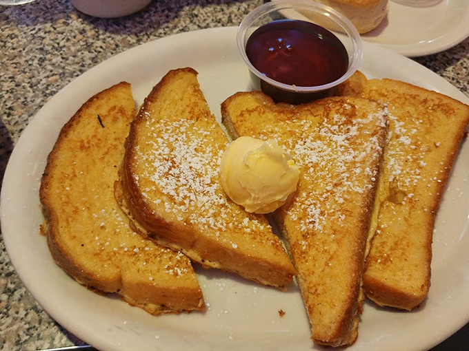 French toast that looks like it graduated from culinary school: Golden-brown, dusted with powdered sugar, and ready for its close-up. Photo credit: Jonathan Shearer