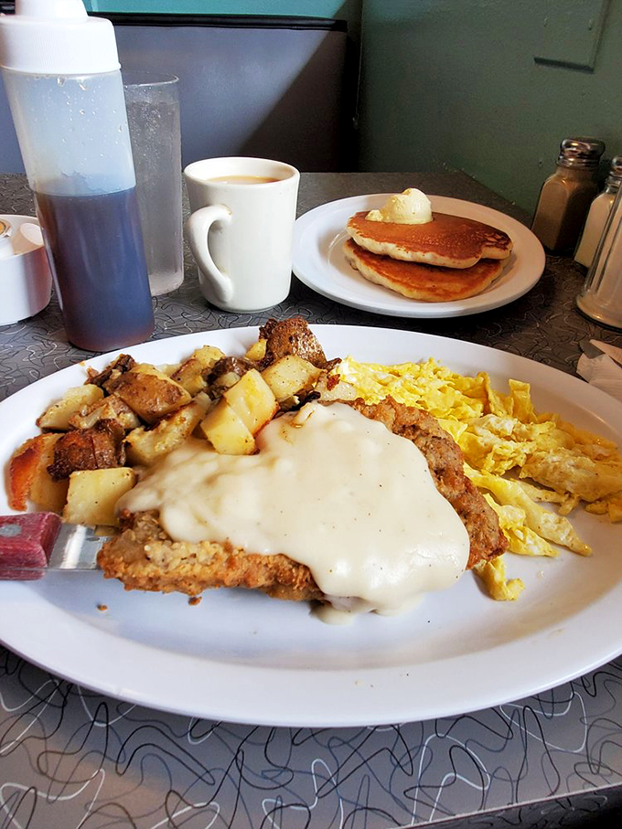 Country-fried steak swimming in gravy, with eggs and potatoes playing backup to this breakfast symphony.