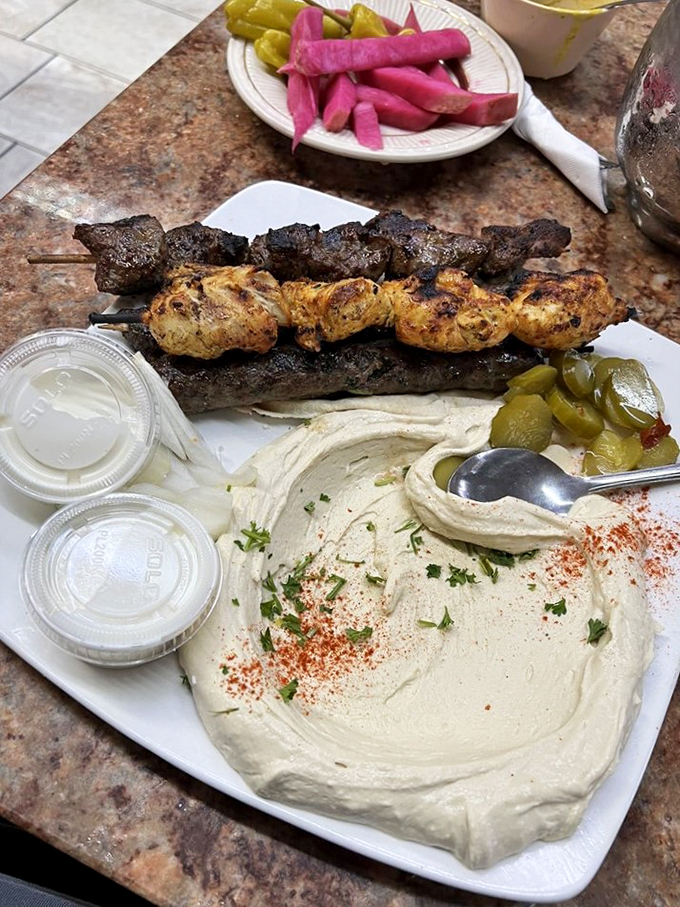 Silky smooth hummus adorned with olive oil and a dusting of paprika&mdash;comfort food that speaks a universal language.