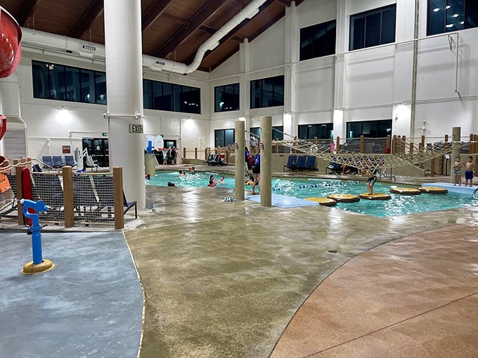 Forget the lazy river, this is a crazy river! Inner tubes navigate twists and turns while onlookers plot their aquatic strategy. Photo credit: K A