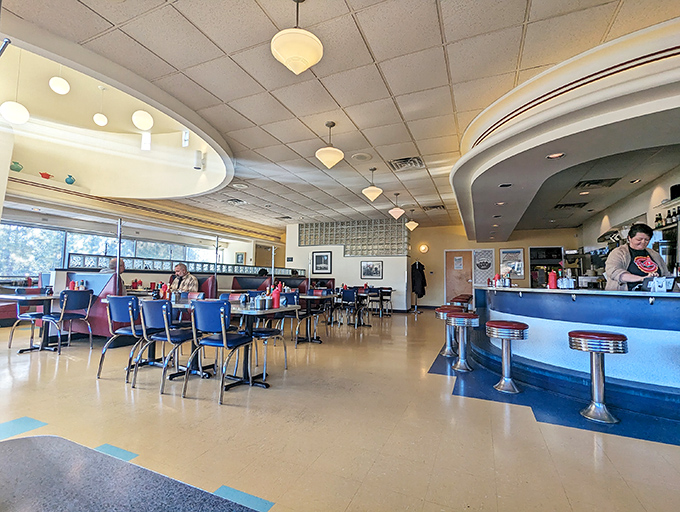 Retro chic meets modern appetite! This dining room isn't just serving meals; it's offering a passport to a time when vinyl was king and milkshakes ruled.