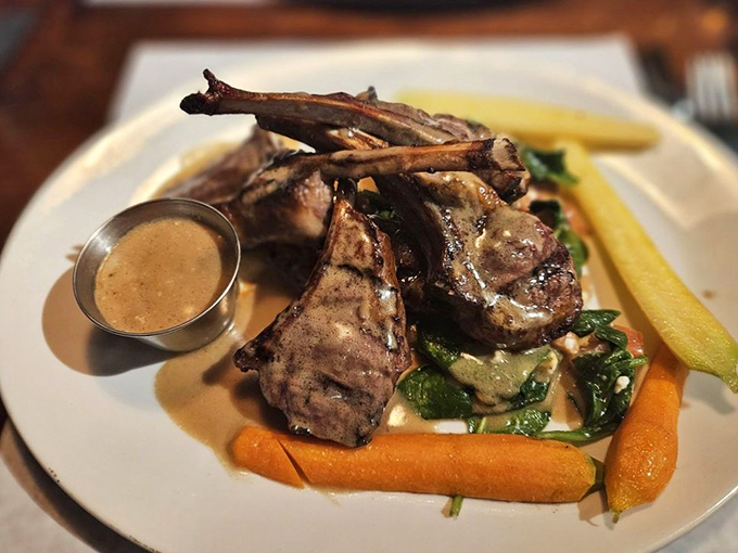 These lamb chops aren't just dinner - they're a statement piece, perfectly posed with their long bones reaching skyward like edible architecture.