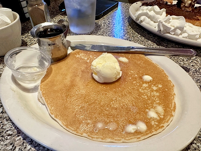 This pancake is so perfectly golden, it could make IHOP jealous. That scoop of butter melting on top? Pure breakfast poetry. Photo credit: Ron Rogers