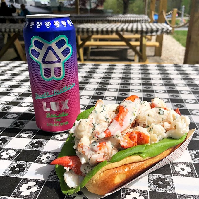 Summer in a bun: This lobster roll is packed with sweet meat and served with local craft beer.