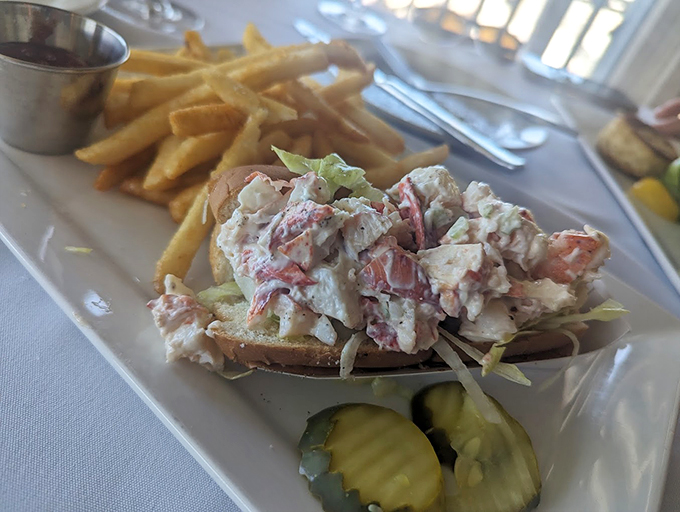 The classic Maine lobster roll: where fresh-picked meat meets mayo and celery in a dance of delicious simplicity. Photo credit: Cameron Full