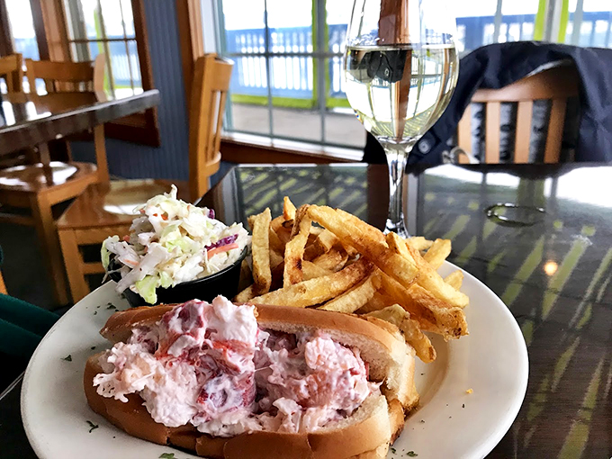The classic Maine lobster roll, generously stuffed and served with hand-cut fries and coleslaw &ndash; summer on a plate.