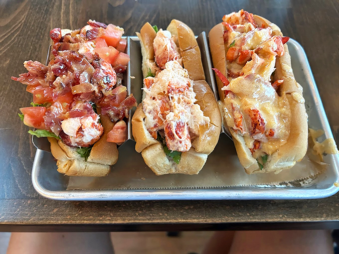 Three perfectly crafted lobster rolls, each a testament to Maine's seafood mastery. Simple, elegant, and utterly irresistible. Photo credit: Alex Courtright