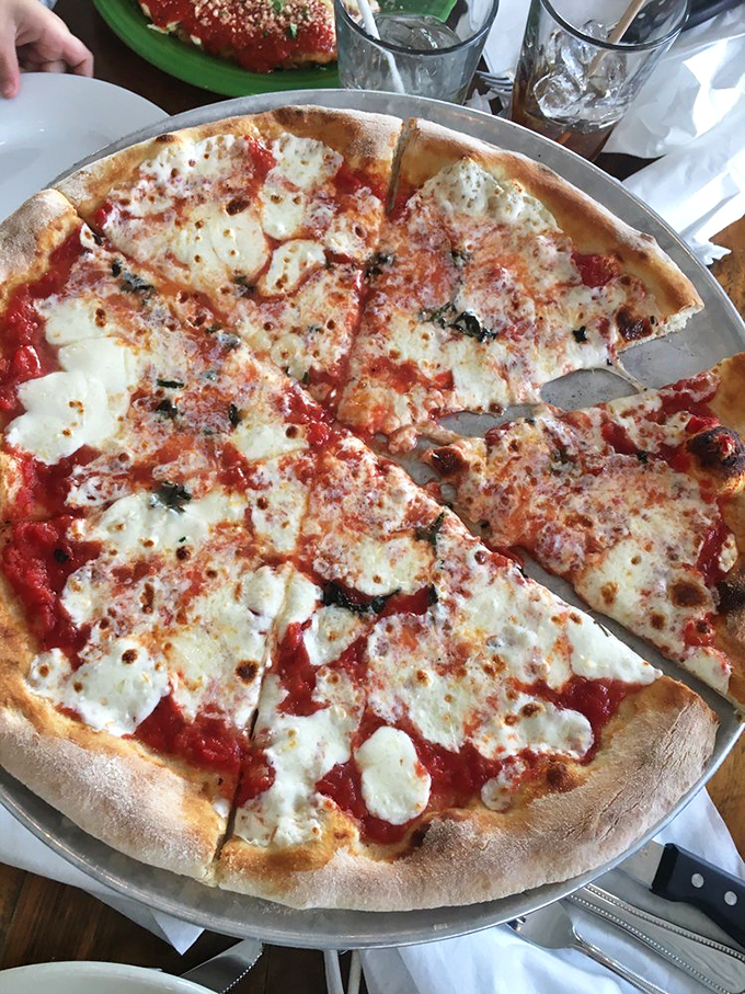 Simple ingredients telling a complex story of flavor. Each slice is like a postcard from Naples delivered to Maine.