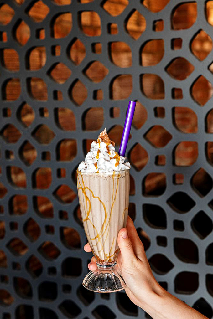 A towering masterpiece of whipped cream and caramel that makes you wonder if dessert should actually come first.