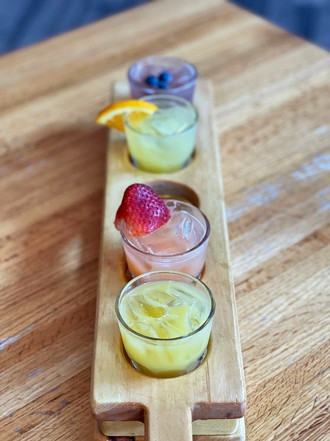 A rainbow of refreshment lined up like liquid jewels. Each sip tells its own story of weekend relaxation.