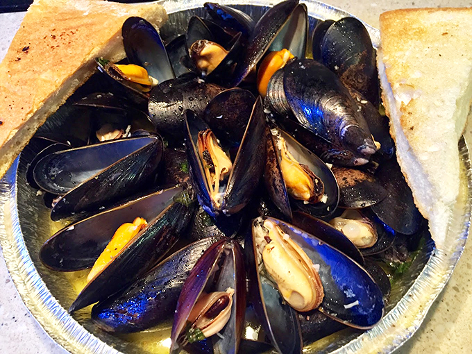 These mussels aren't just fresh &ndash; they're having a spa day in white wine and garlic sauce. Pure maritime meditation. Photo credit: Jim Brickett