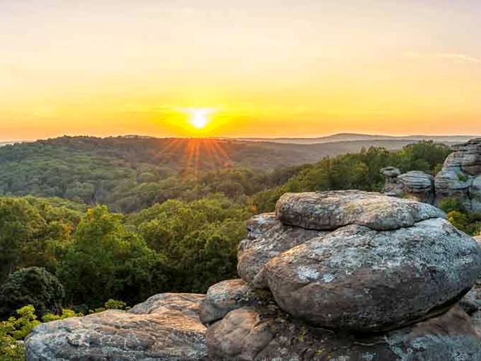Nature's own masterpiece: sunset paints the rocky outcrops in golden hues while ancient formations stand sentinel over the valley.