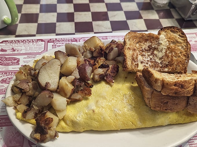 This omelet is like a warm, eggy hug filled with all the good stuff. It's not a meal; it's an edible work of art.