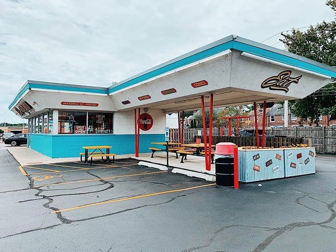 Yellow benches under turquoise trim&mdash;where summer memories are made one bite at a time.