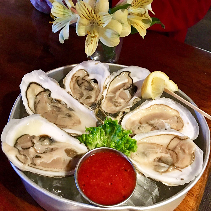Fresh oysters on ice, lined up like pearls on a plate, waiting to share their briny stories of the sea. Photo credit: sridhar sambangi