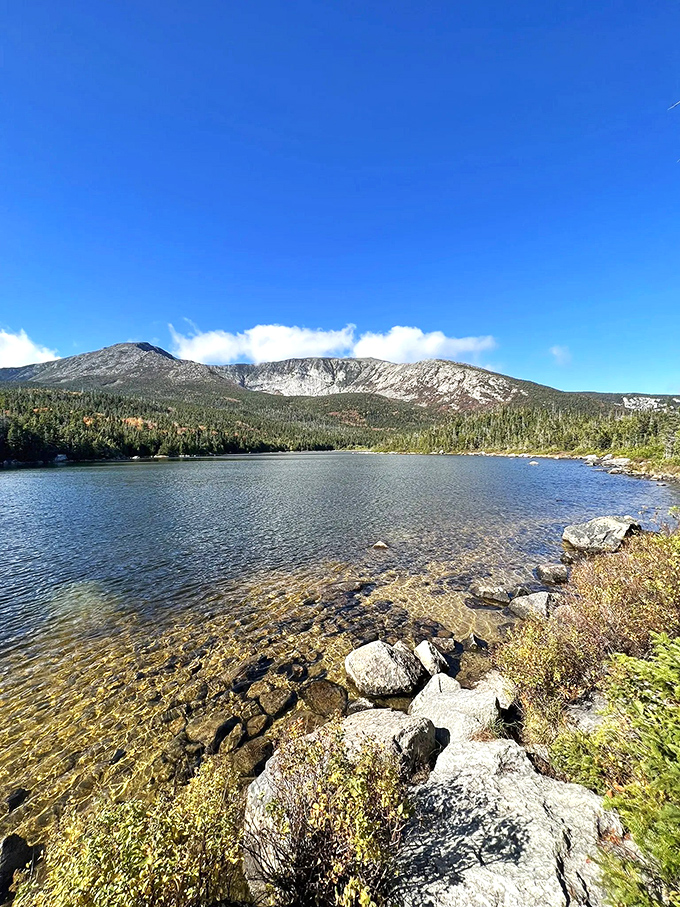 Basin Pond mirrors the mountains like nature's infinity pool, complete with a backdrop that puts Hollywood sets to shame.
