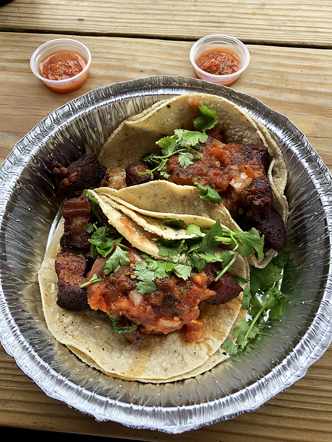 Pork belly tacos with a side of sass! These bad boys come with house-made salsas that'll make your taste buds tango.
