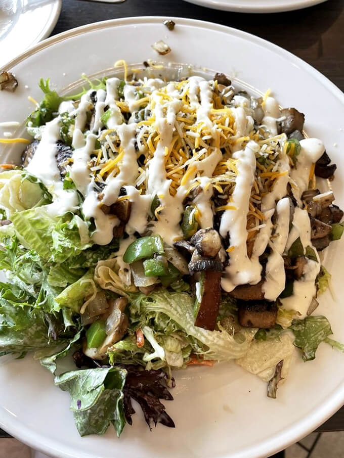 A garden-fresh salad that's dressed to impress, with mushrooms and cheese playing leading roles in this leafy production.