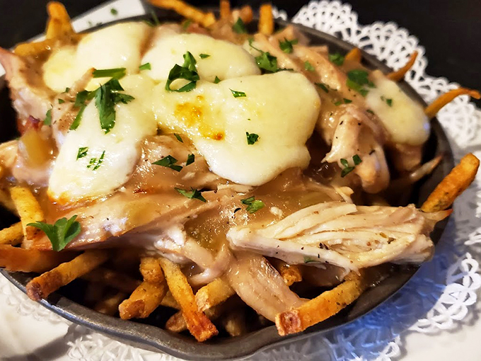French fries living their best life under a blanket of gravy and melted cheese - comfort food gone fancy.